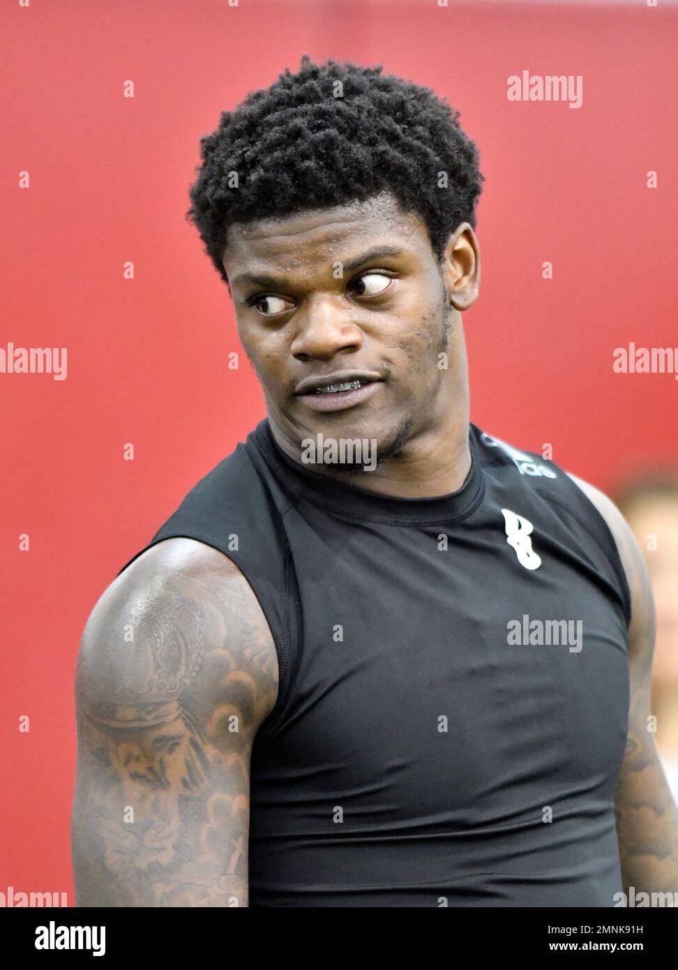 University of Louisville quarterback Lamar Jackson warms up before his ...