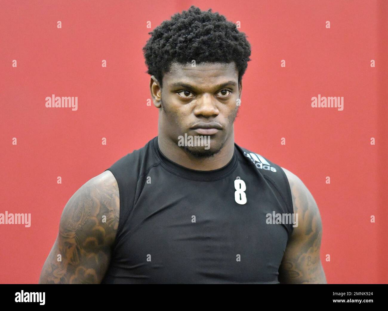 University of Louisville quarterback Lamar Jackson warms up before his ...