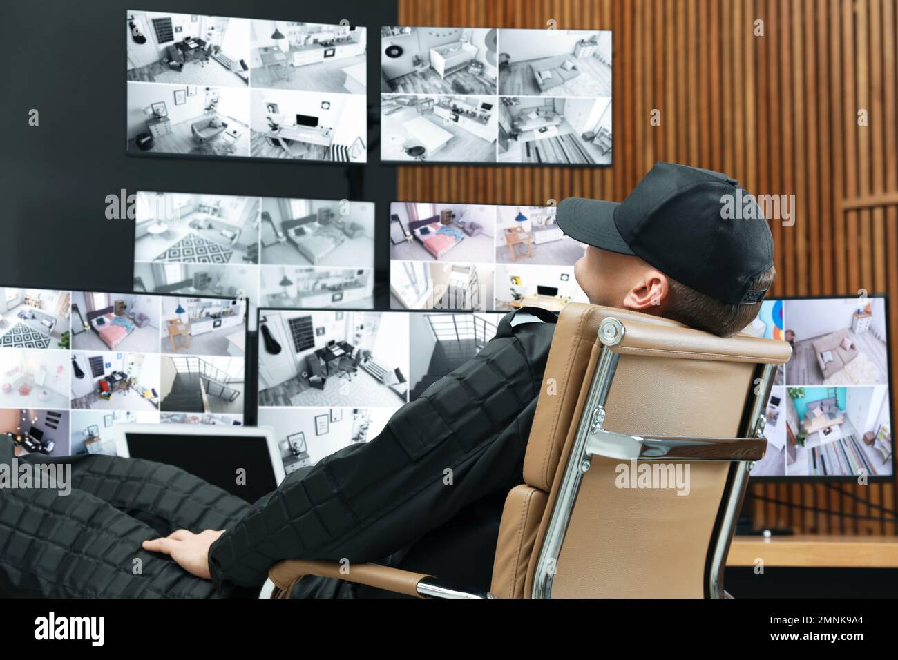 Tired security guard sleeping at workplace in office Stock Photo - Alamy