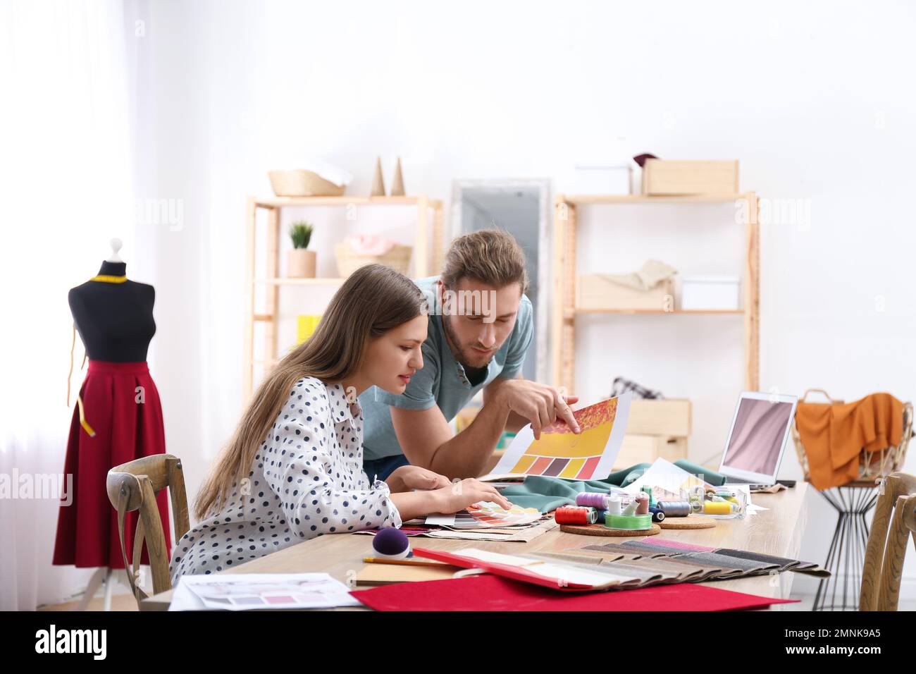 Fashion designers creating new clothes in studio Stock Photo - Alamy