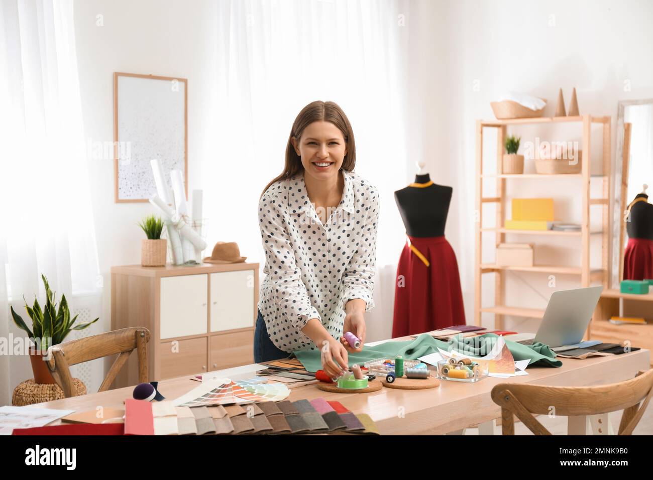 Fashion designer creating new clothes in studio Stock Photo - Alamy