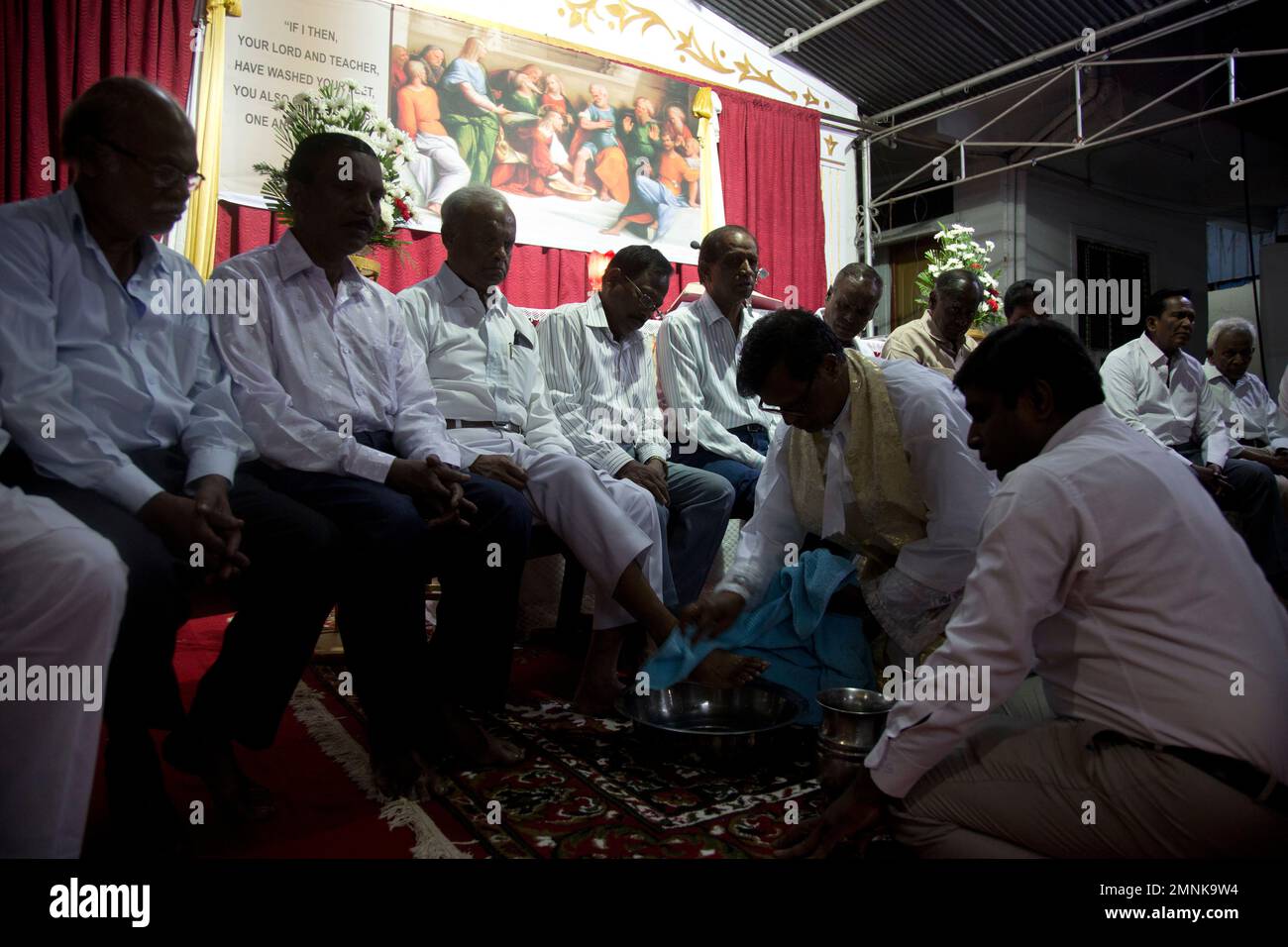An Indian Catholic Priest performs ritual washing of feet of a ...