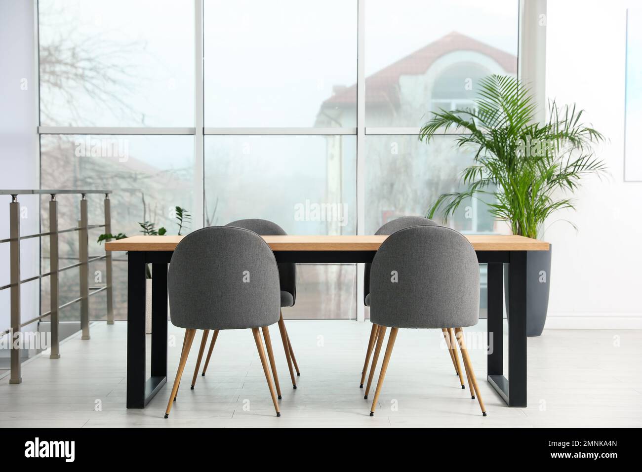 Modern room interior with chairs and table Stock Photo - Alamy