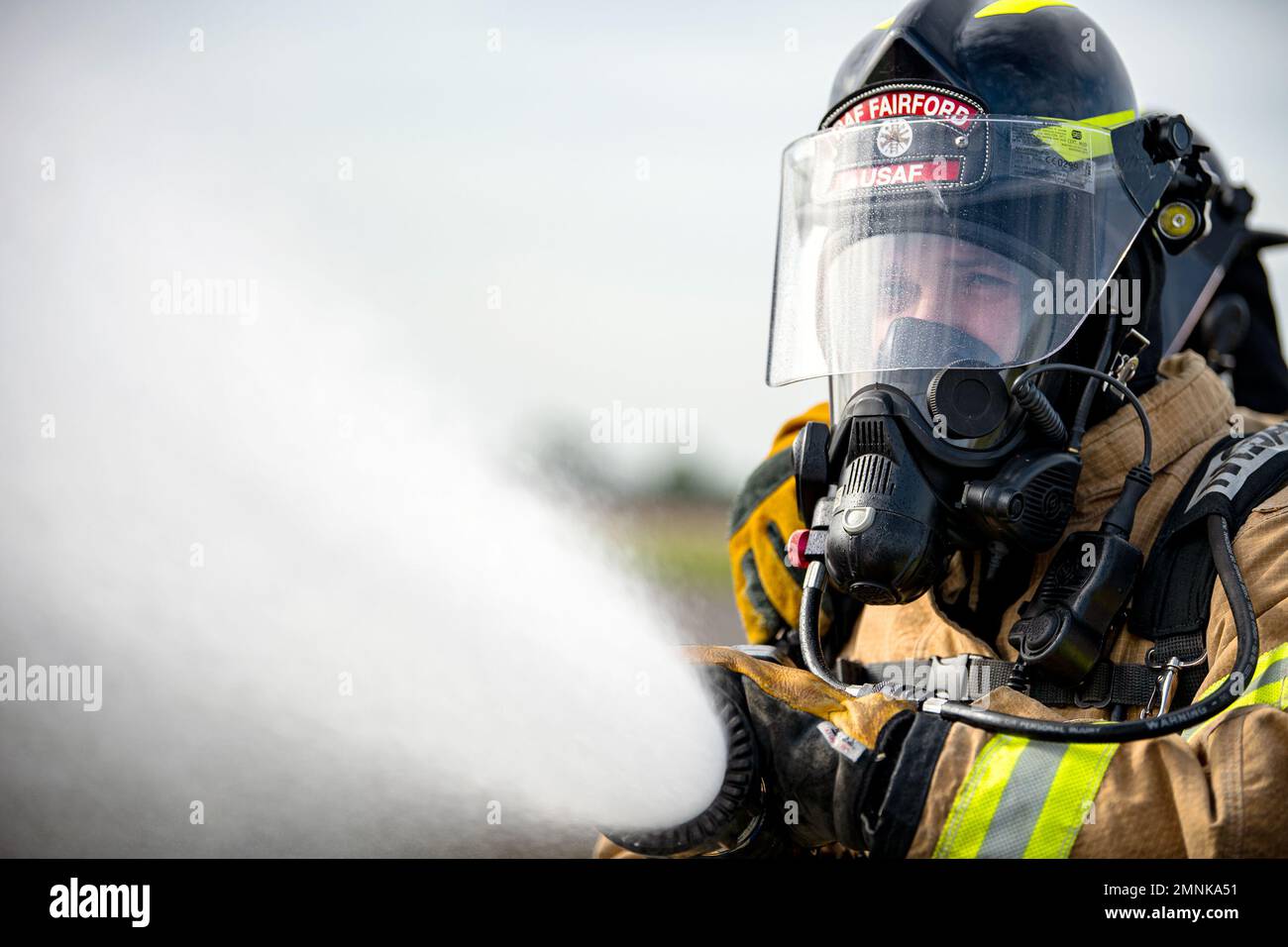 A firefighter from the 422d Fire Emergency Services extinguishes an ...