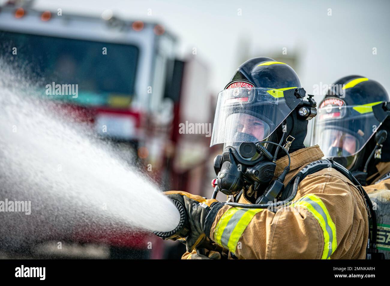 Firefighters from the 422d Fire Emergency Services extinguish an ...
