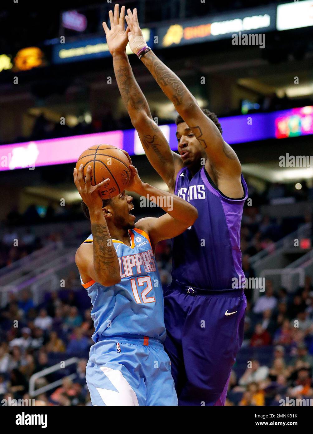 Los Angeles Clippers guard Tyrone Wallace (12) tries to shoot over ...