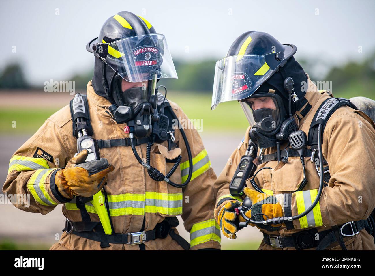 Firefighters from the 422d Fire Emergency Services, check their oxygen ...