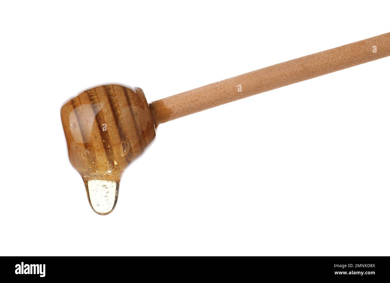 Honey dripping from wooden dipper isolated on white Stock Photo - Alamy