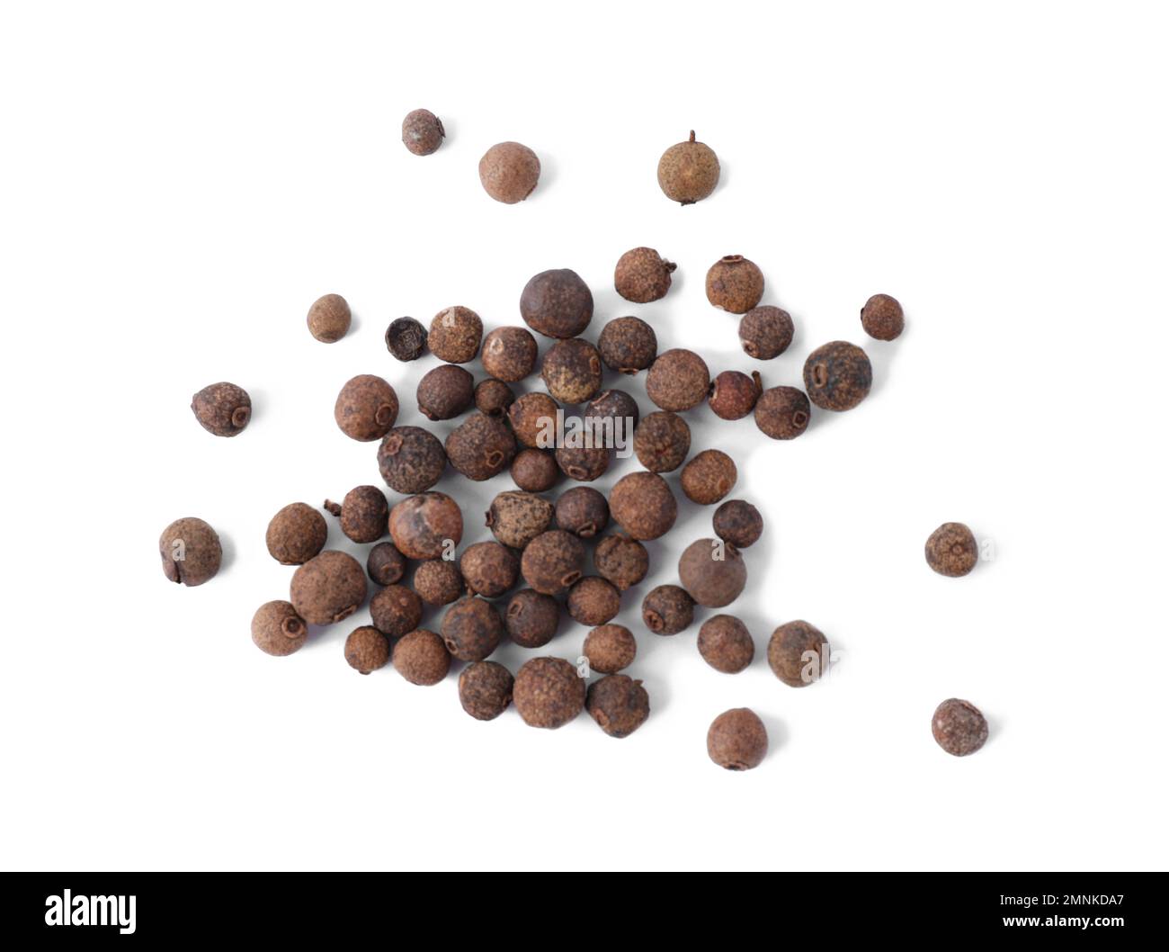 Black pepper grains on white background, top view Stock Photo - Alamy