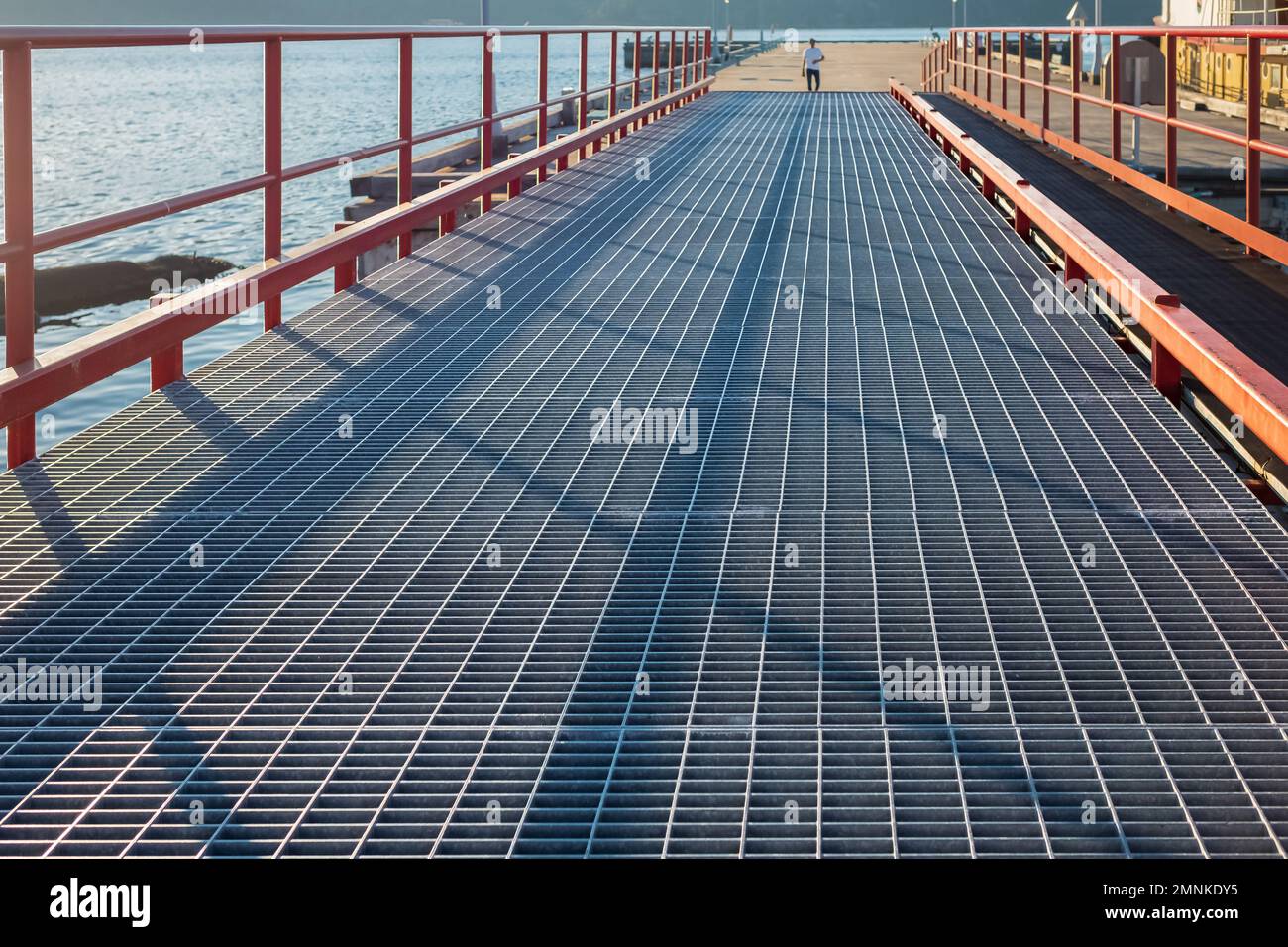 Walkway ramp to lake boat dock. Steel ramp walkway leading to boat ...