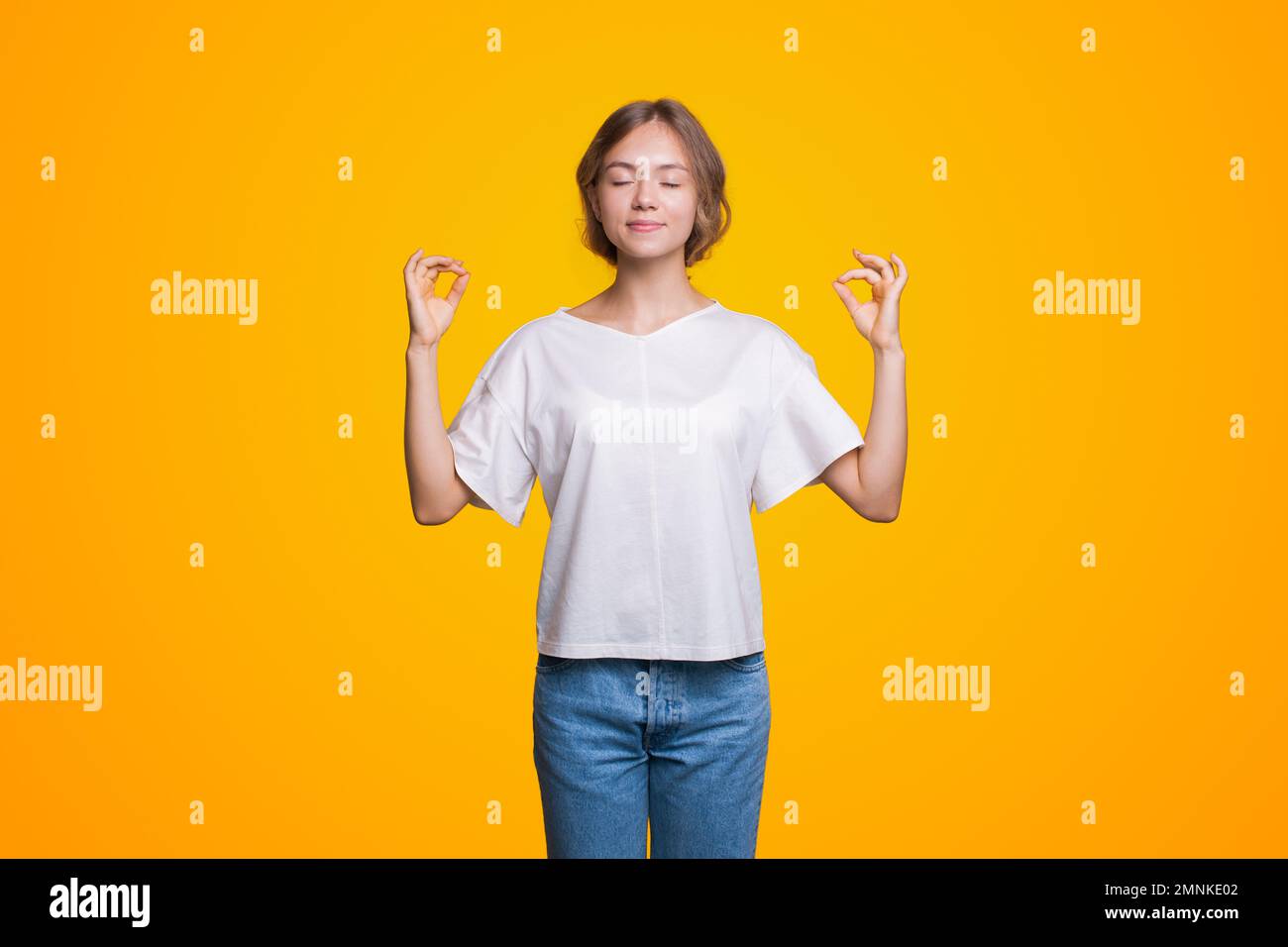 Peaceful relaxed woman meditating, breathing, inhale fresh air ...