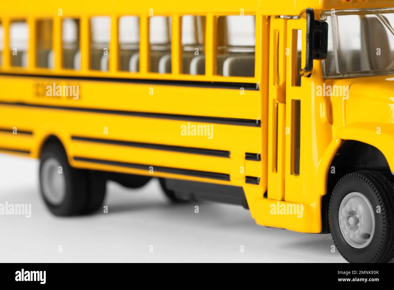 Yellow school bus on white background, closeup. Transport for students ...