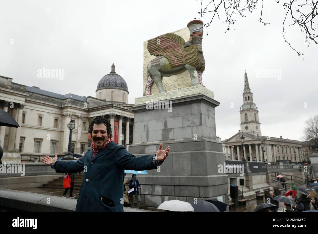 Iraqi American artist Michael Rakowitz poses for photographers after ...