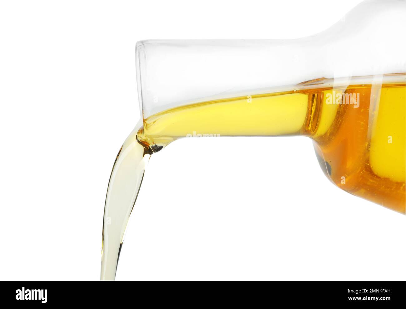 Pouring cooking oil from pitcher isolated on white Stock Photo - Alamy
