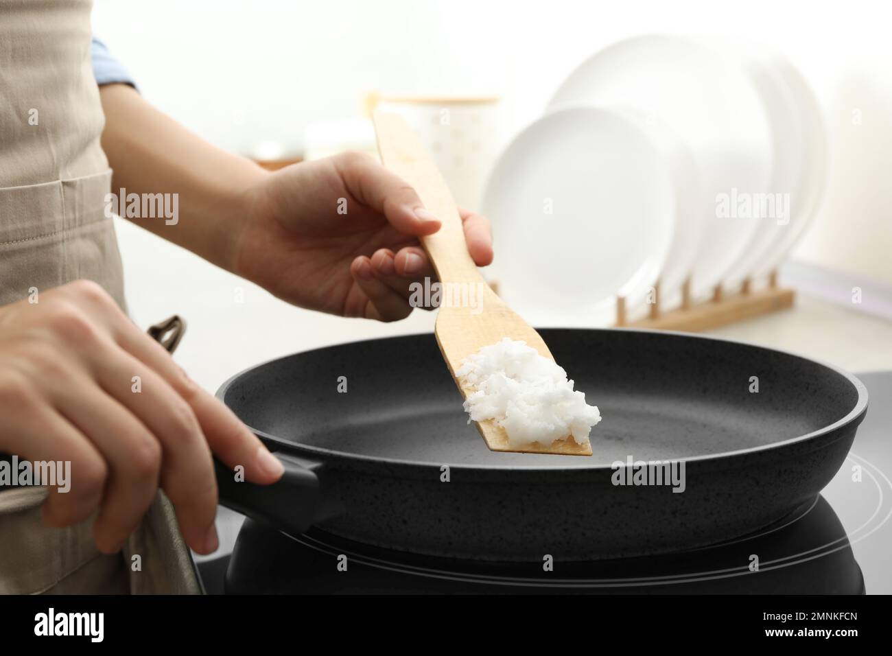 Woman cooking with oil hi-res stock photography and images - Alamy