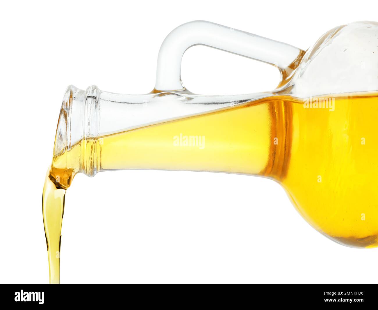 Pouring cooking oil from pitcher isolated on white Stock Photo - Alamy