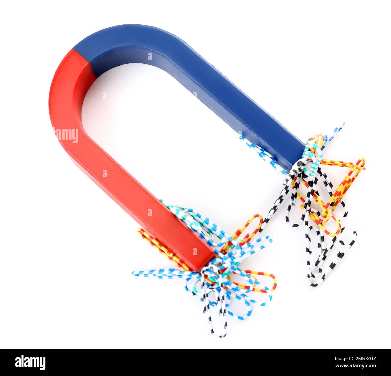 Magnet attracting paper clips on white background, top view Stock Photo ...