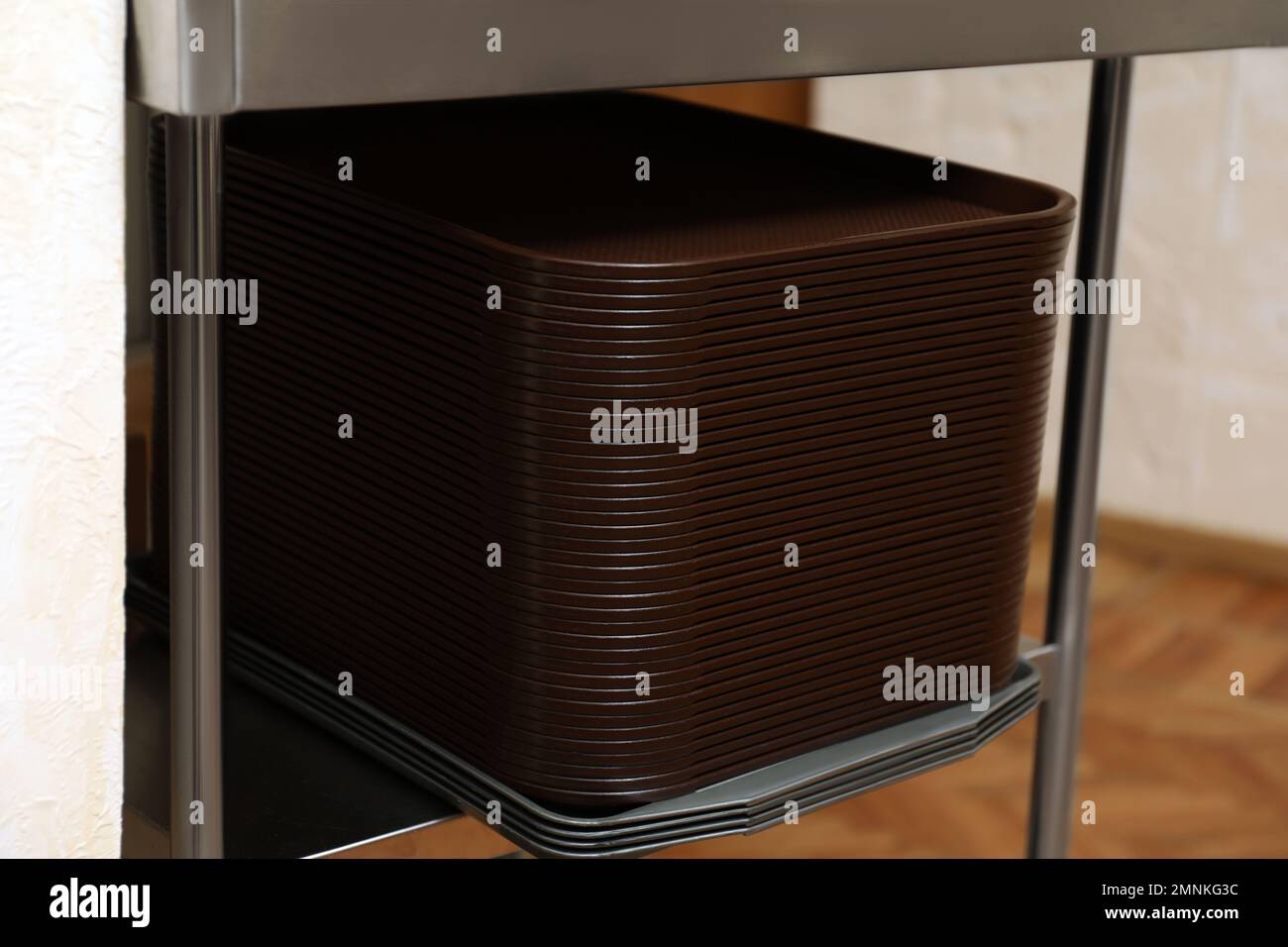 Stack of plastic trays for food in school canteen Stock Photo - Alamy