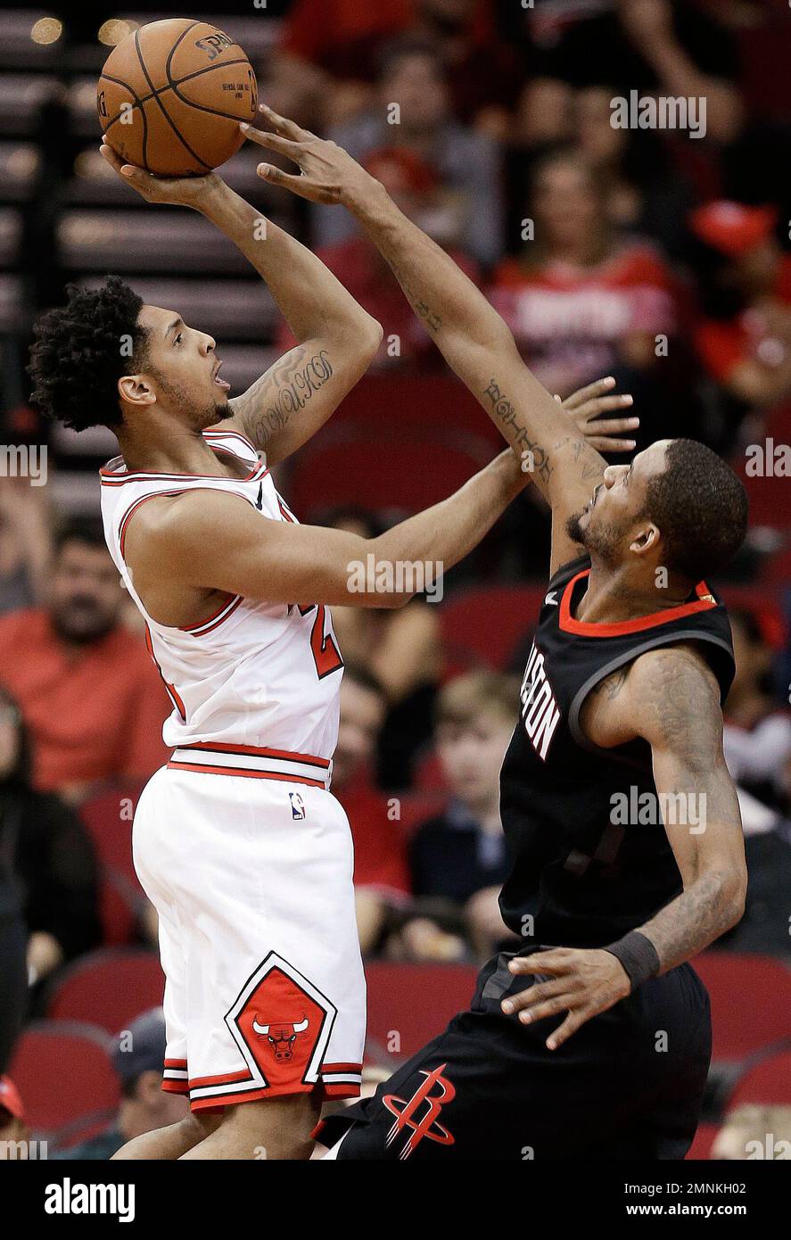 Chicago Bulls guard Cameron Payne, left, shoots as Houston Rockets ...