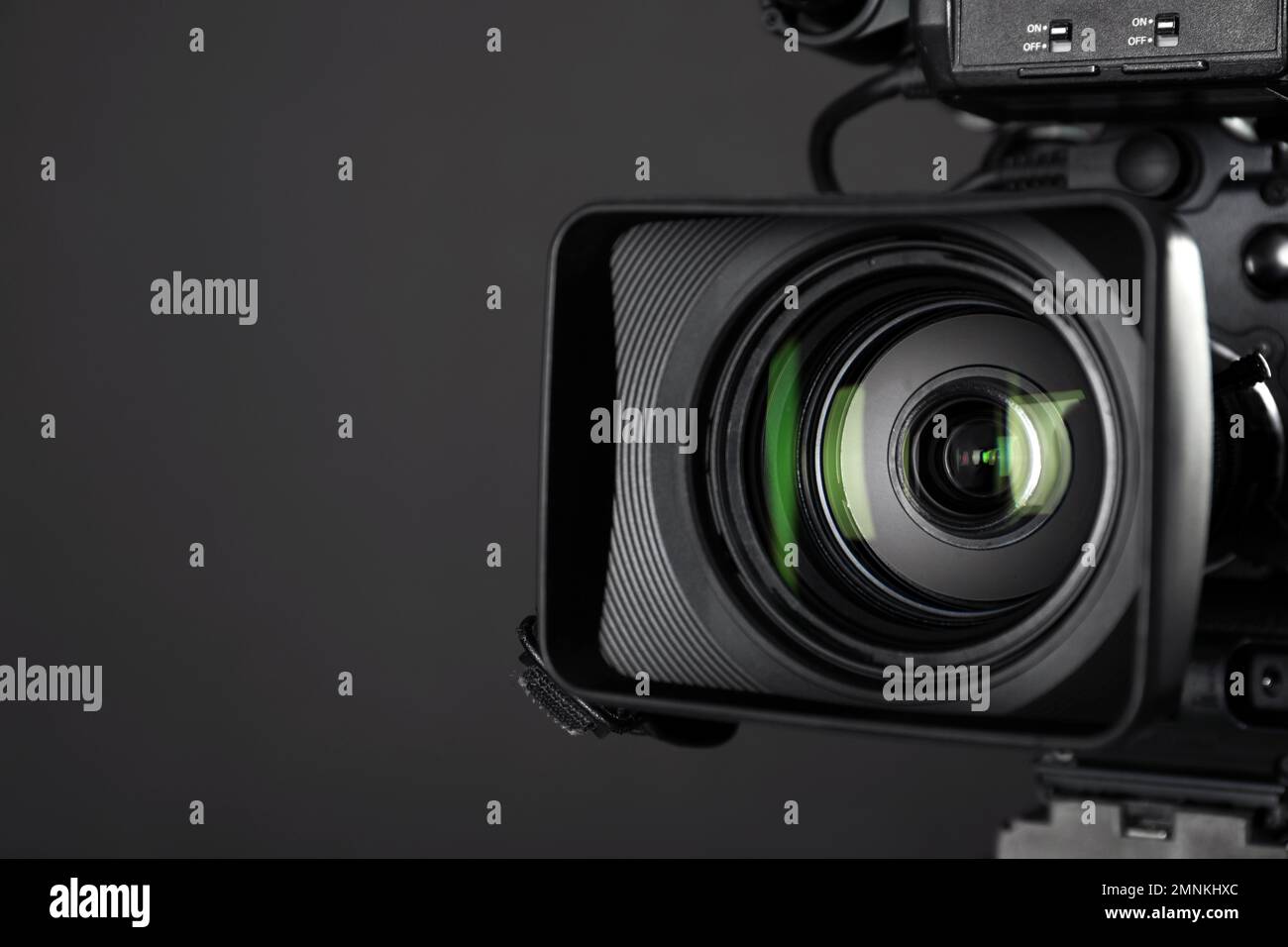 Modern professional video camera on black background, closeup Stock ...