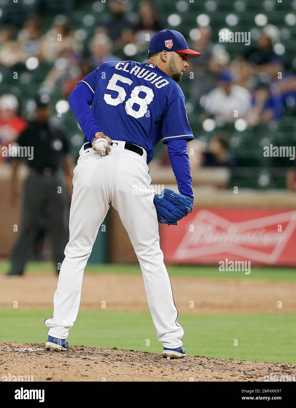 Texas Rangers relief pitcher Alex Claudio (58) prepares to throw in the ...