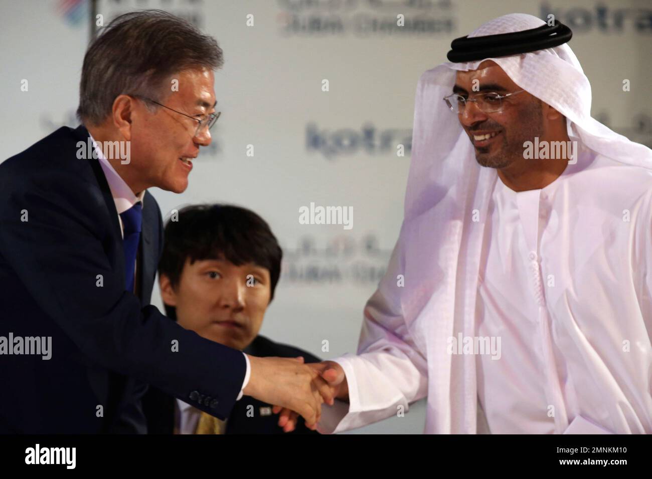 South Korean President Moon Jae-in, left, shakes hands with Dubai Chamber of Commerce and ...
