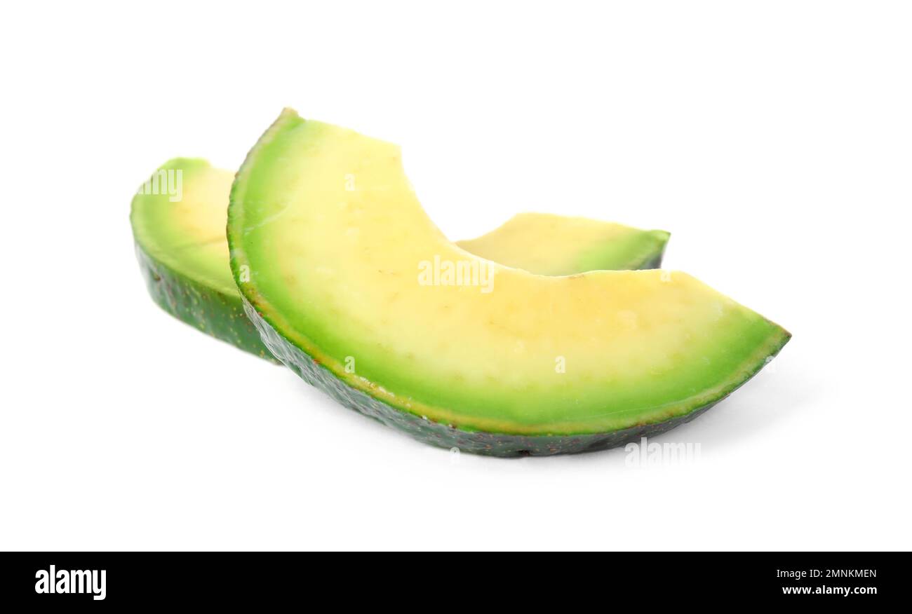 Slices of raw avocado isolated on white Stock Photo - Alamy