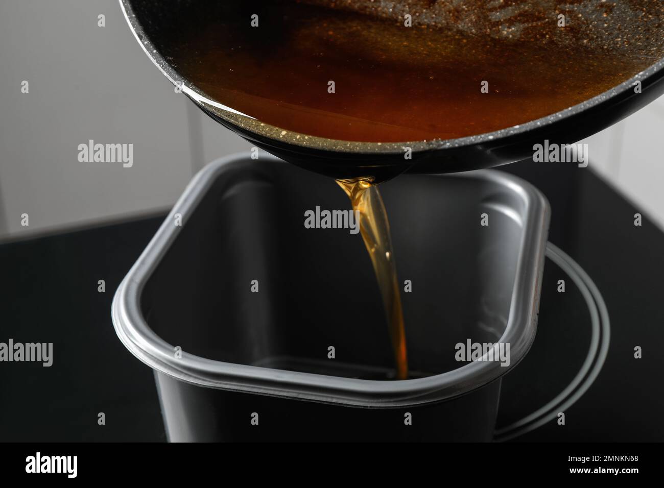 Pouring used cooking oil hi-res stock photography and images - Alamy