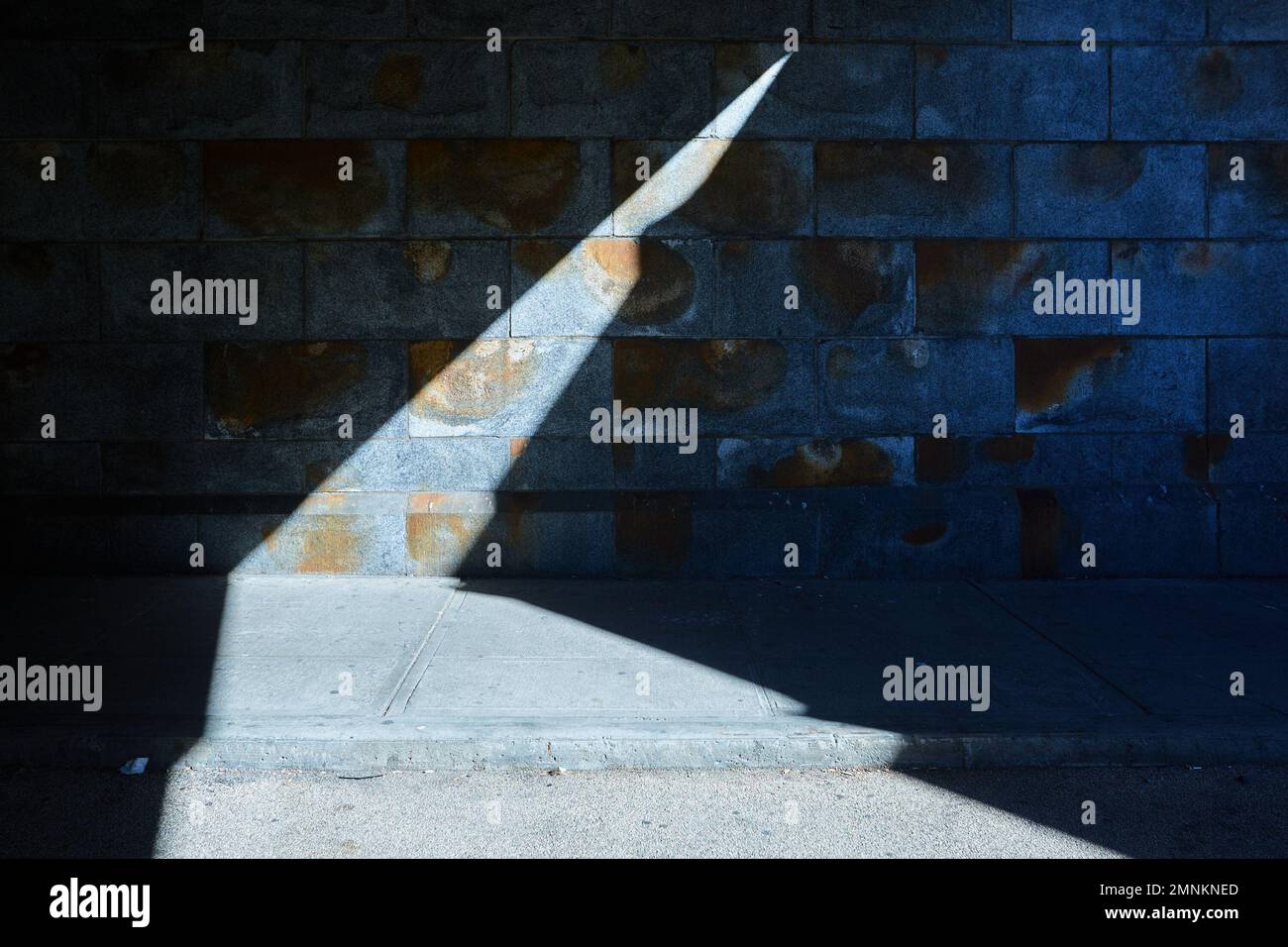 Diagonal Shaft of Light in a Dark Passageway Stock Photo - Alamy