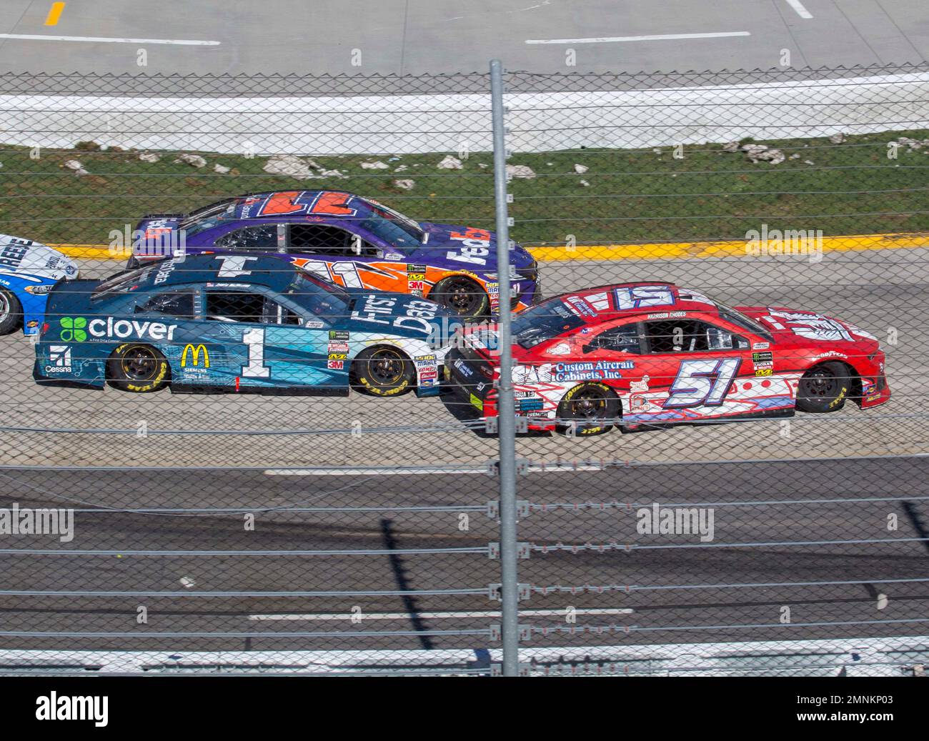Jamie McMurray (1) gets into Harrison Rhodes (51) during a NASCAR Cup ...