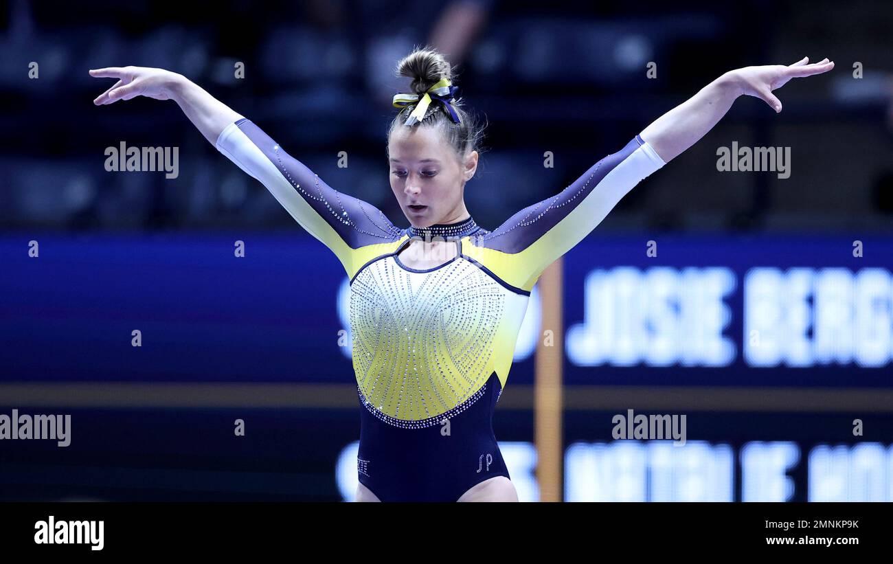 West Virginia's Emily Holmes-Hackard competes on beam during an NCAA ...