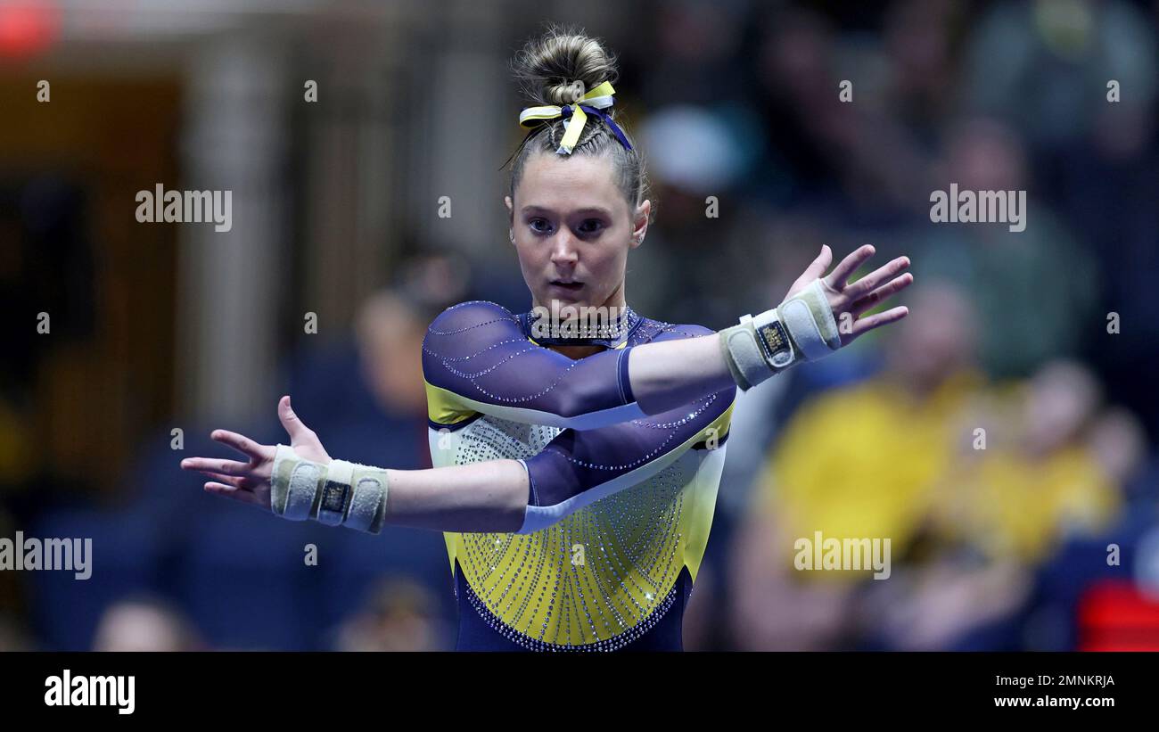 West Virginia's Emily Holmes-Hacker competes on floor during an NCAA ...