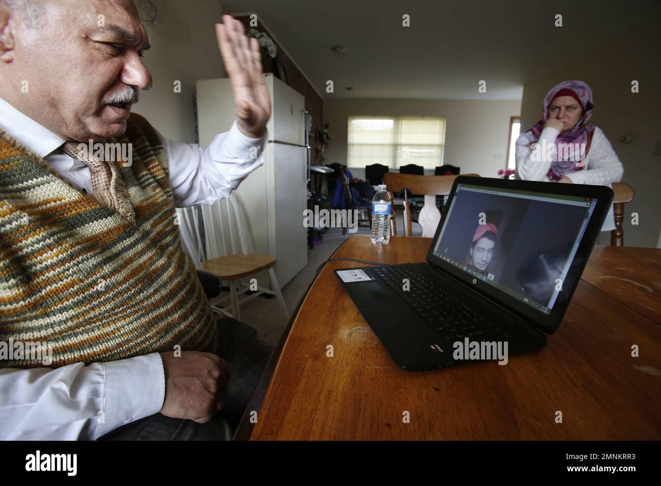 Rifat Moustafa, a Syrian immigrant, greets his 16-year-old son, Hasib ...