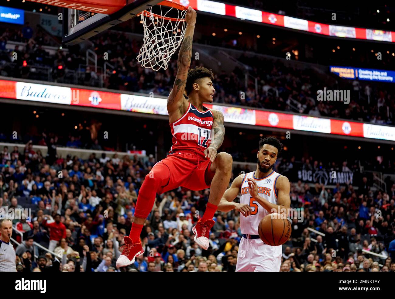 Washington Wizards forward Kelly Oubre Jr. (12) hangs on the rim after ...