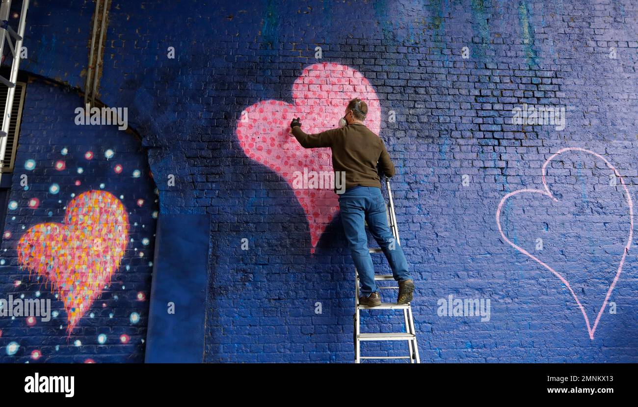 Australian street artist James Cochran also known as Jimmy C, works on ...