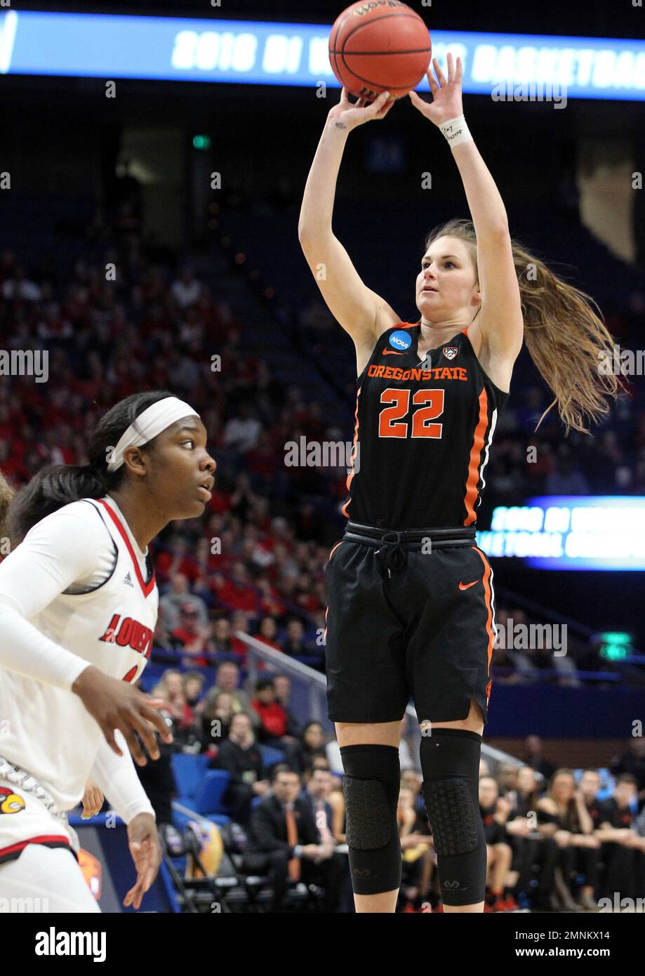 Oregon State's Kat Tudor (22) shoots near Louisville's Myisha Hines ...