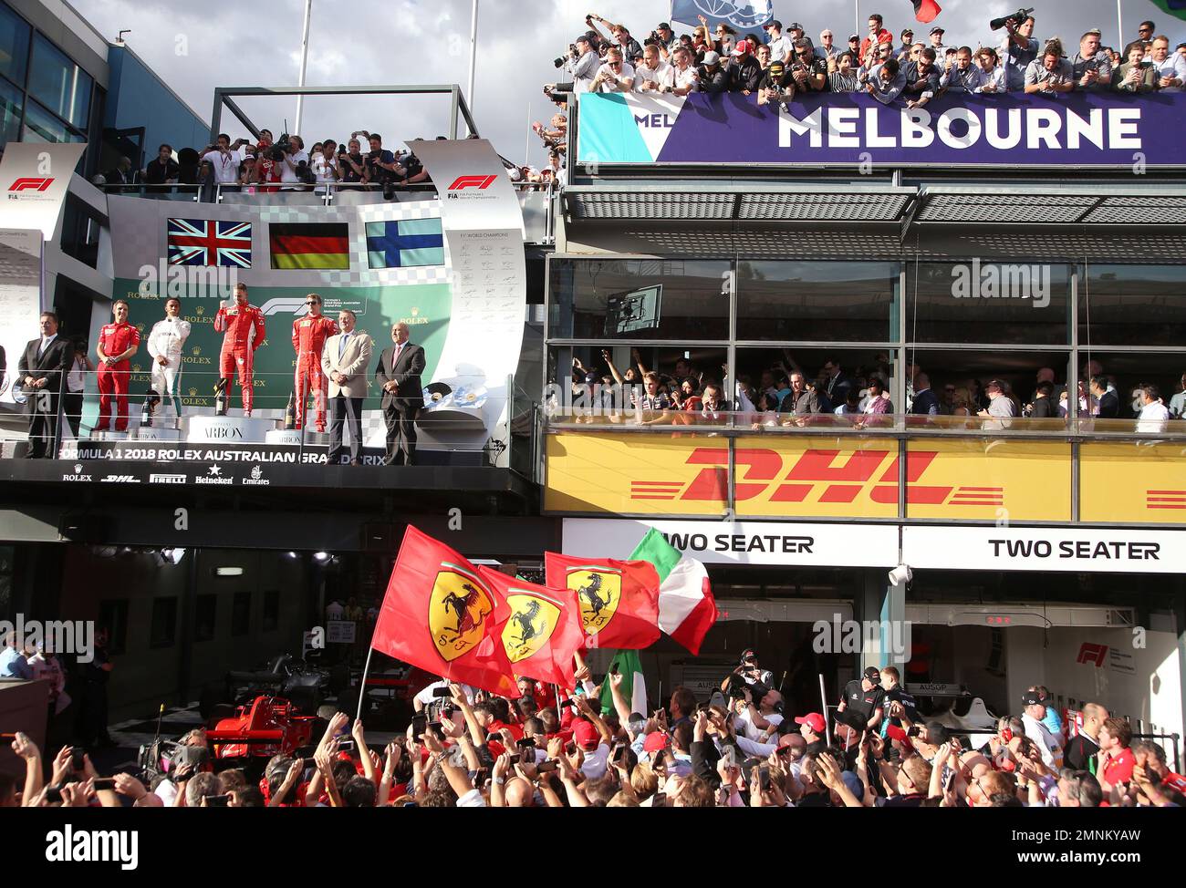 Ferrari driver Sebastian Vettel of Germany, at center on podium, pumps ...