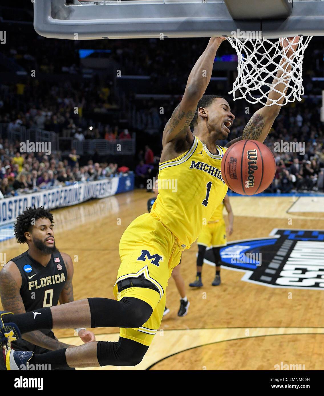 Michigan guard Charles Matthews (1) dunks in front of Florida State ...