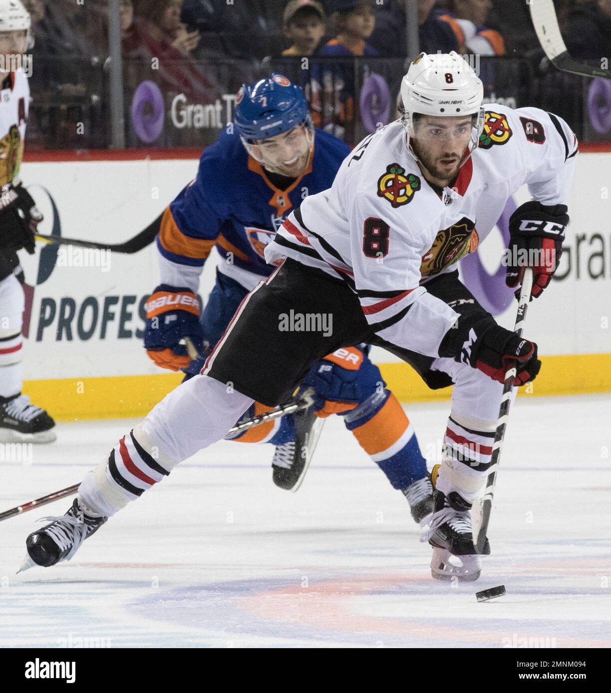 Chicago Blackhawks center Nick Schmaltz (8) skates past New York ...