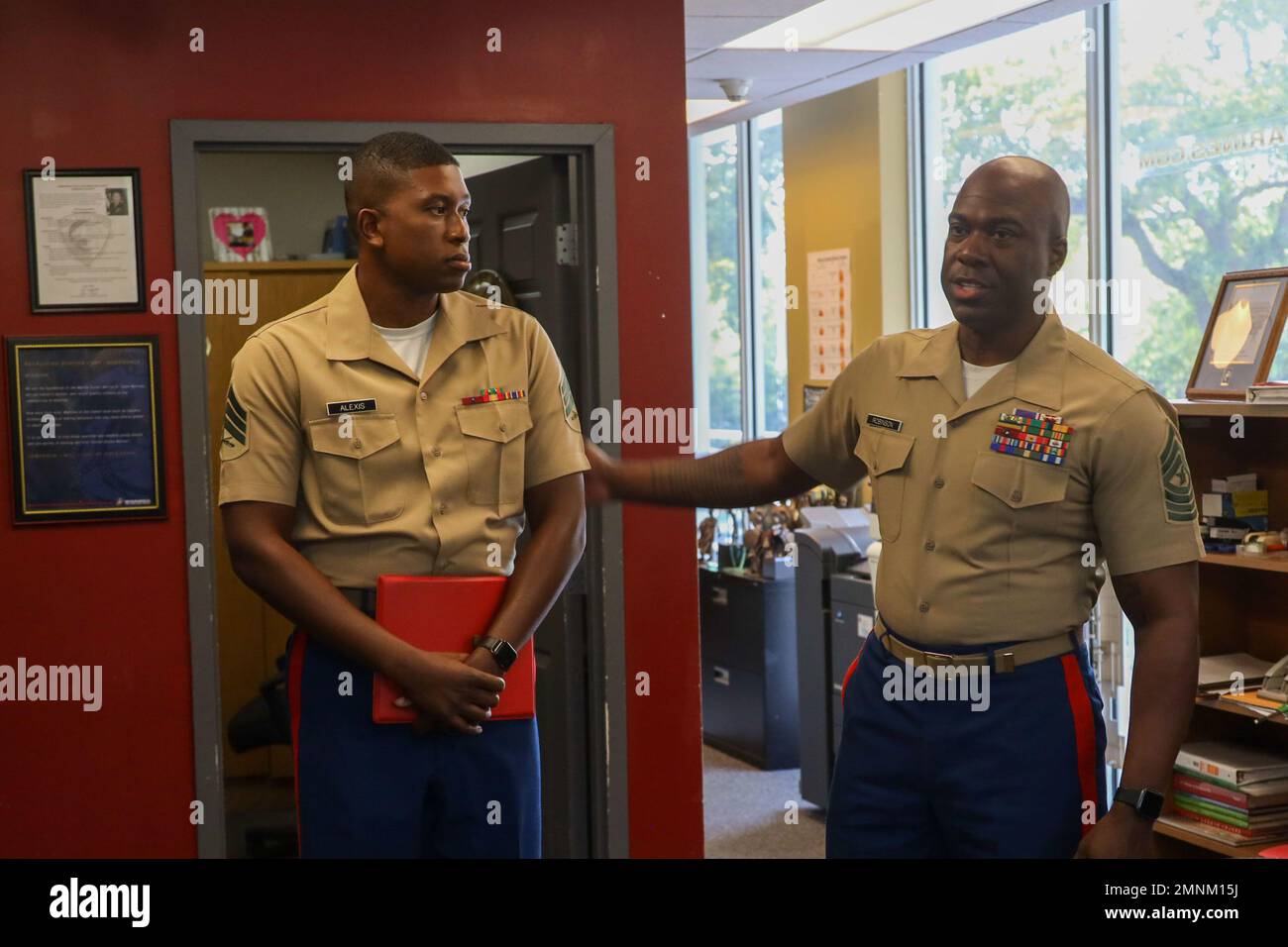 6th Marine Corps District Sergeant Major, Frank Robinson, congratulates ...