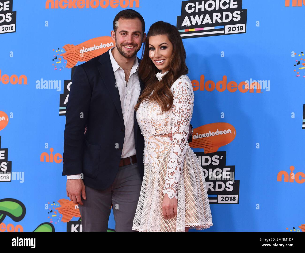 Chris Mazdzer, left, and Mara Marian arrive at the Kids' Choice Awards ...