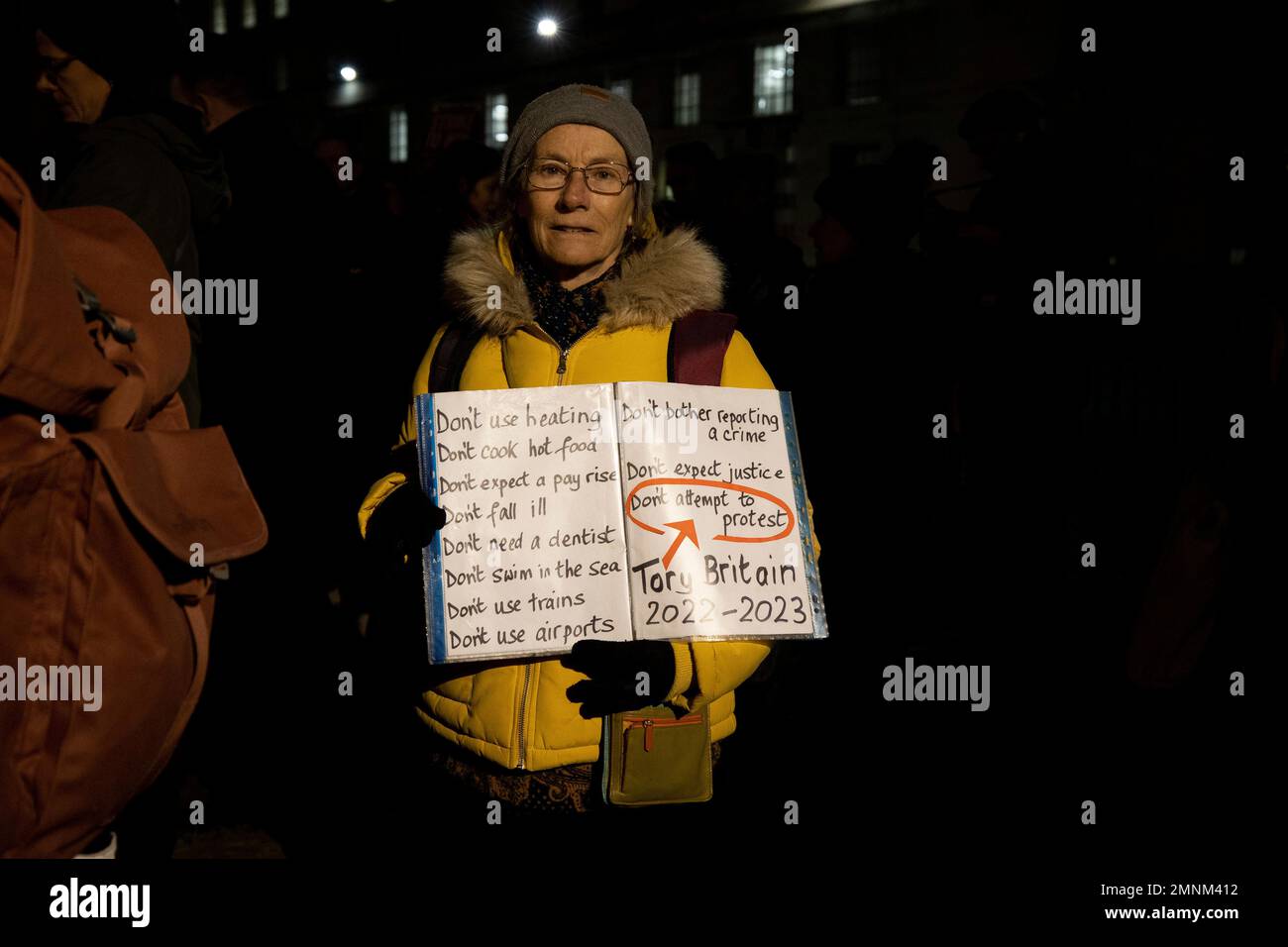 London, UK. 30th Jan, 2023. A protester is seen holding a placard ...