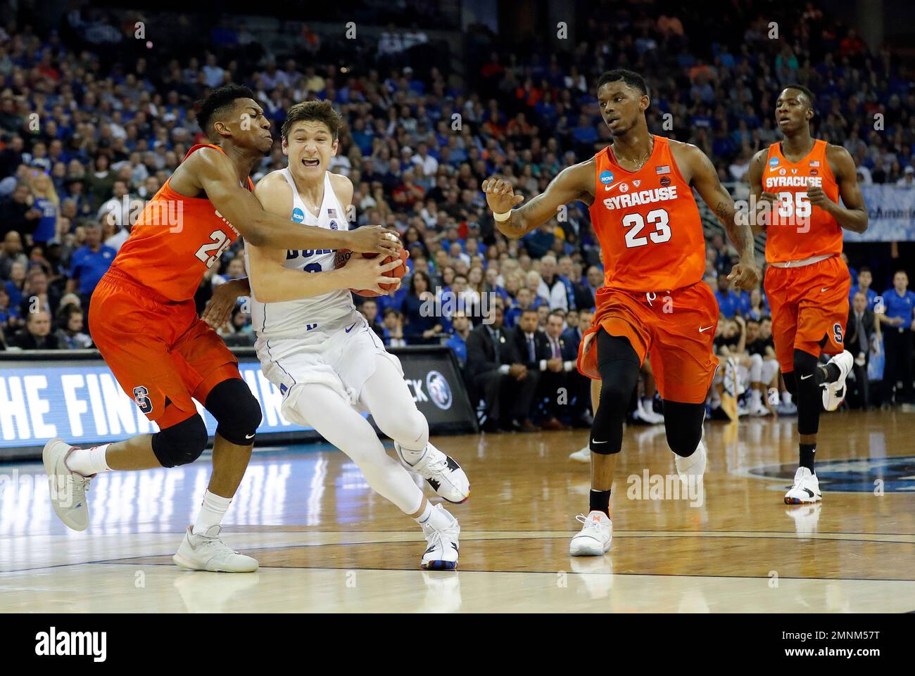 Duke's Grayson Allen heads to the basket as Syracuse's Tyus Battle, left, Frank Howard (23) and ...