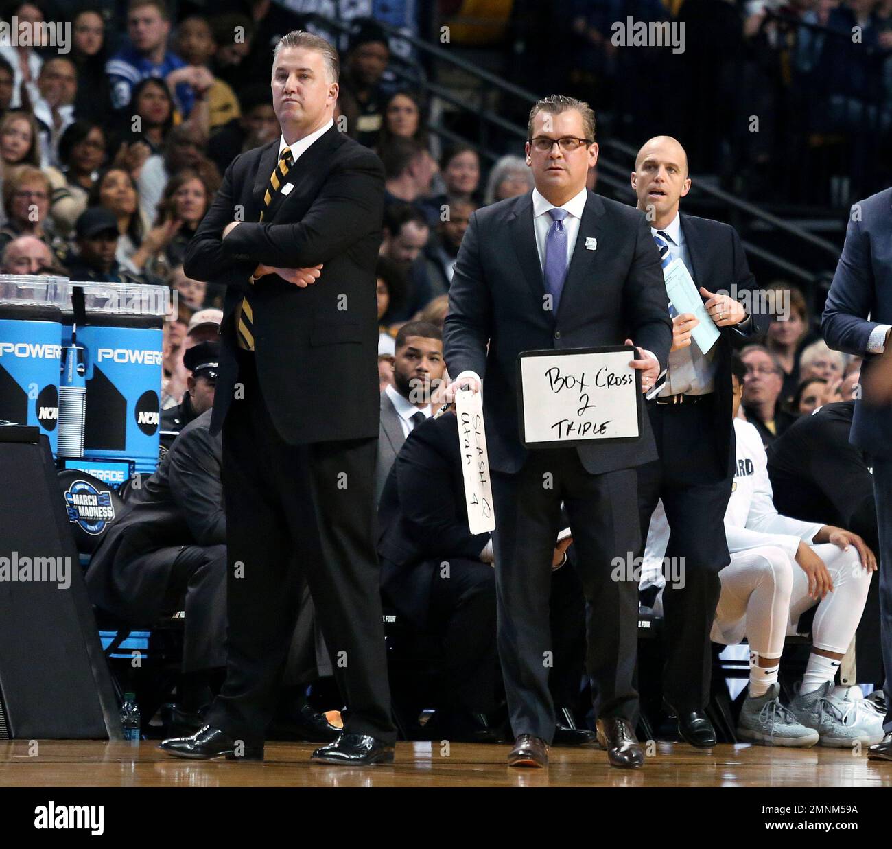 Purdue coach Matt Painter, left, and his coaching staff watch from the ...