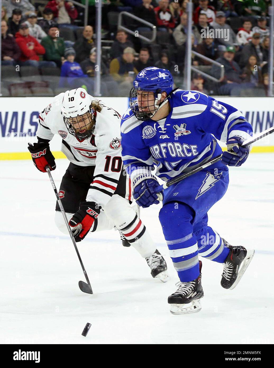 Air Force's Evan Giesler (15) winds up for a shot in front of St. Cloud ...