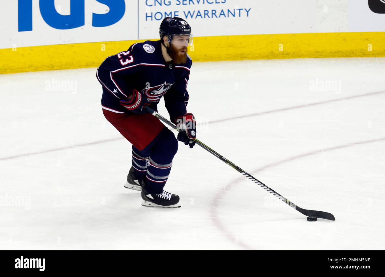 Columbus Blue Jackets defenseman Ian Cole carries the puck against the ...