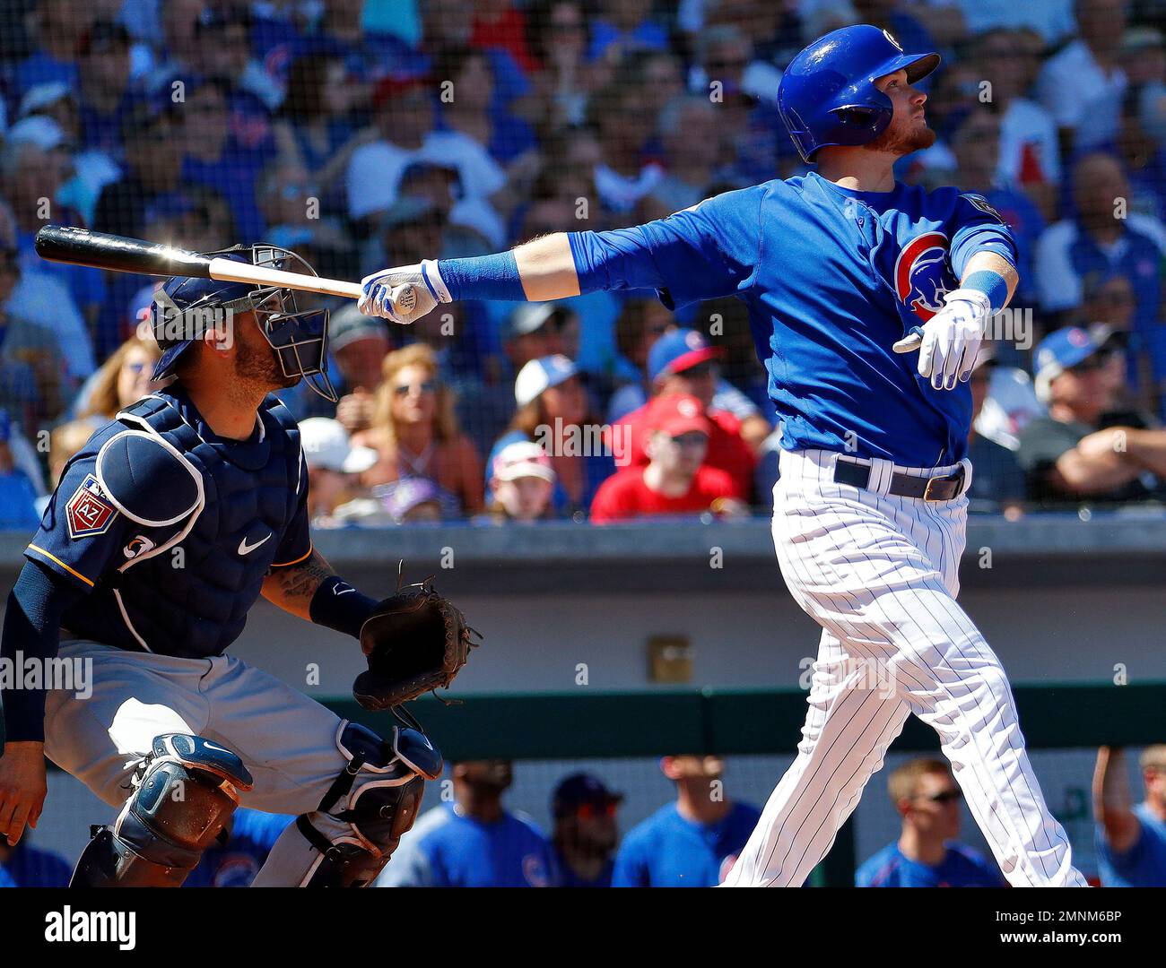 Milwaukee Brewers catcher Manny Pina, left, and Chicago Cubs' Ian Happ ...