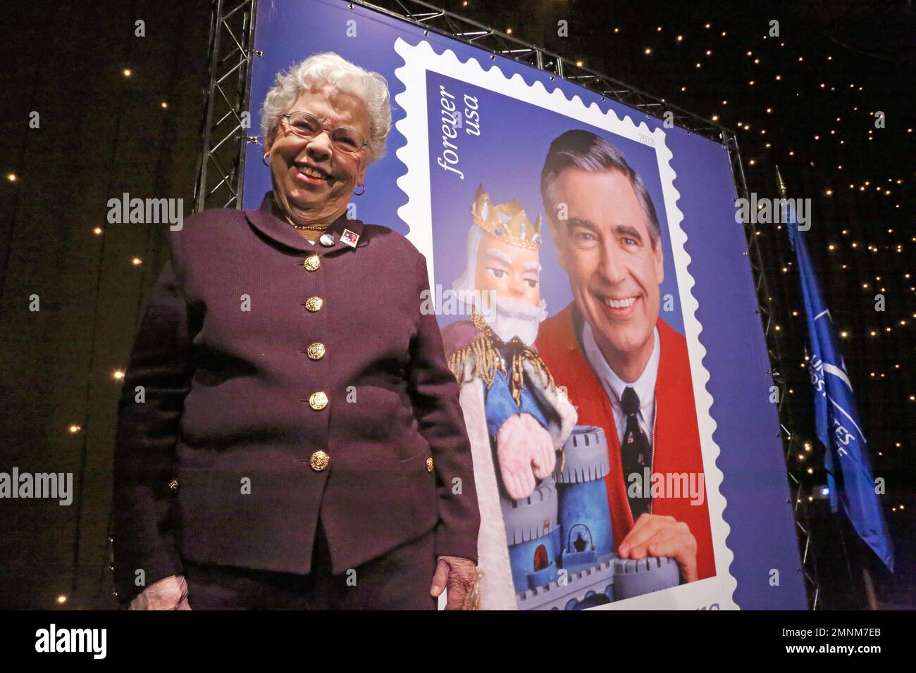 Fred Rogers wife, Mrs. Joanne Rogers poses in front a poster of the ...
