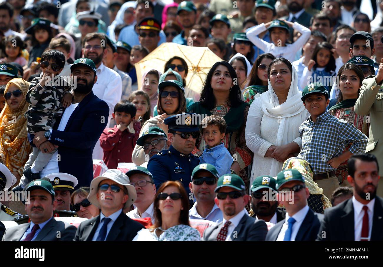 People watch fighter jets demonstrating an aerobatic performance during ...