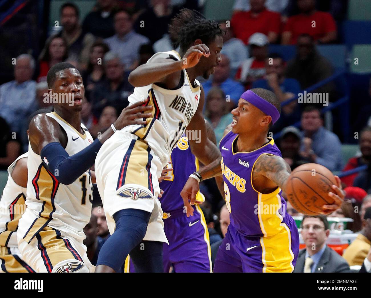 Los Angeles Lakers guard Isaiah Thomas, right, trues to pass around New ...